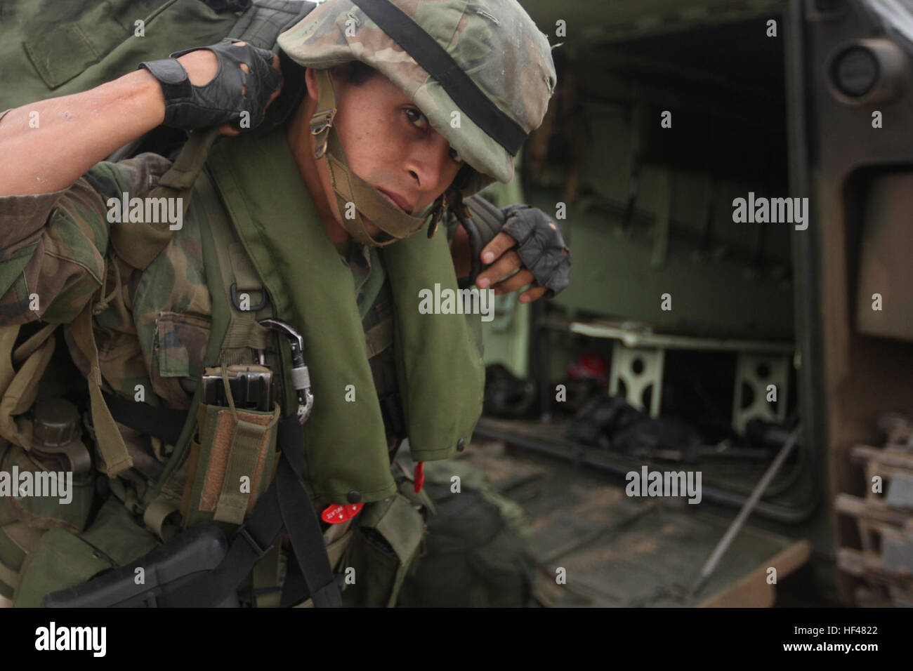 A Peruvian Marine gets dropped off on a beach in Ancon, Peru, on July 7 ...