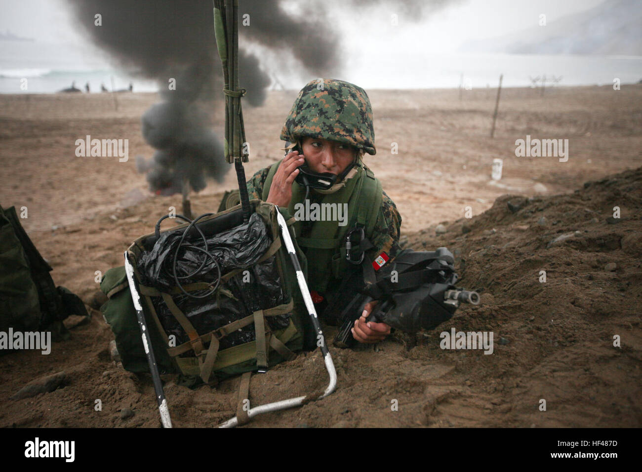 A Peruvian Marine talks over the radio during a large scale ...