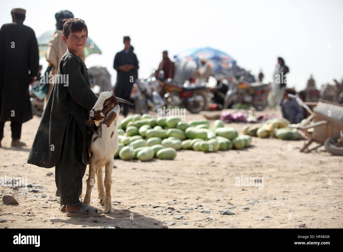A young Afghan boy looks on as Marines with Bravo Company, 1st ...