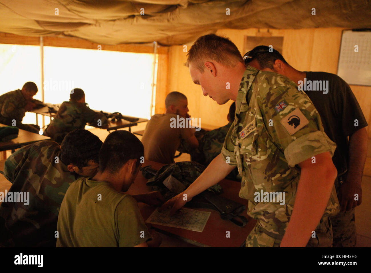 British Lt. Pete Quentin, a member of the team in charge of teaching ...