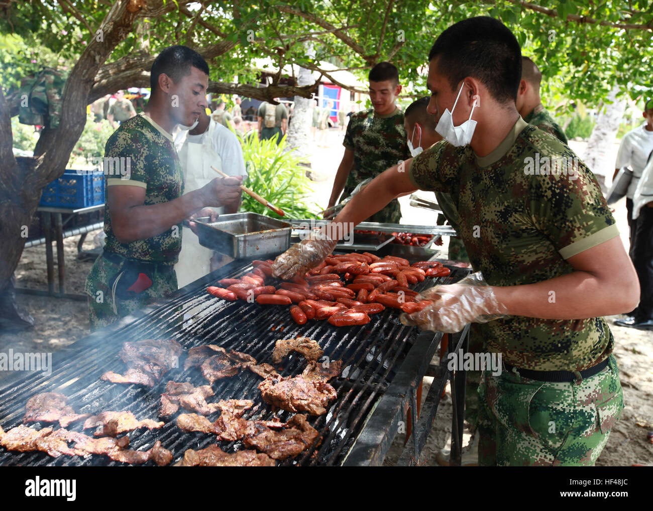 Colombian Marines prepare steak and hot dogs during the closing ...