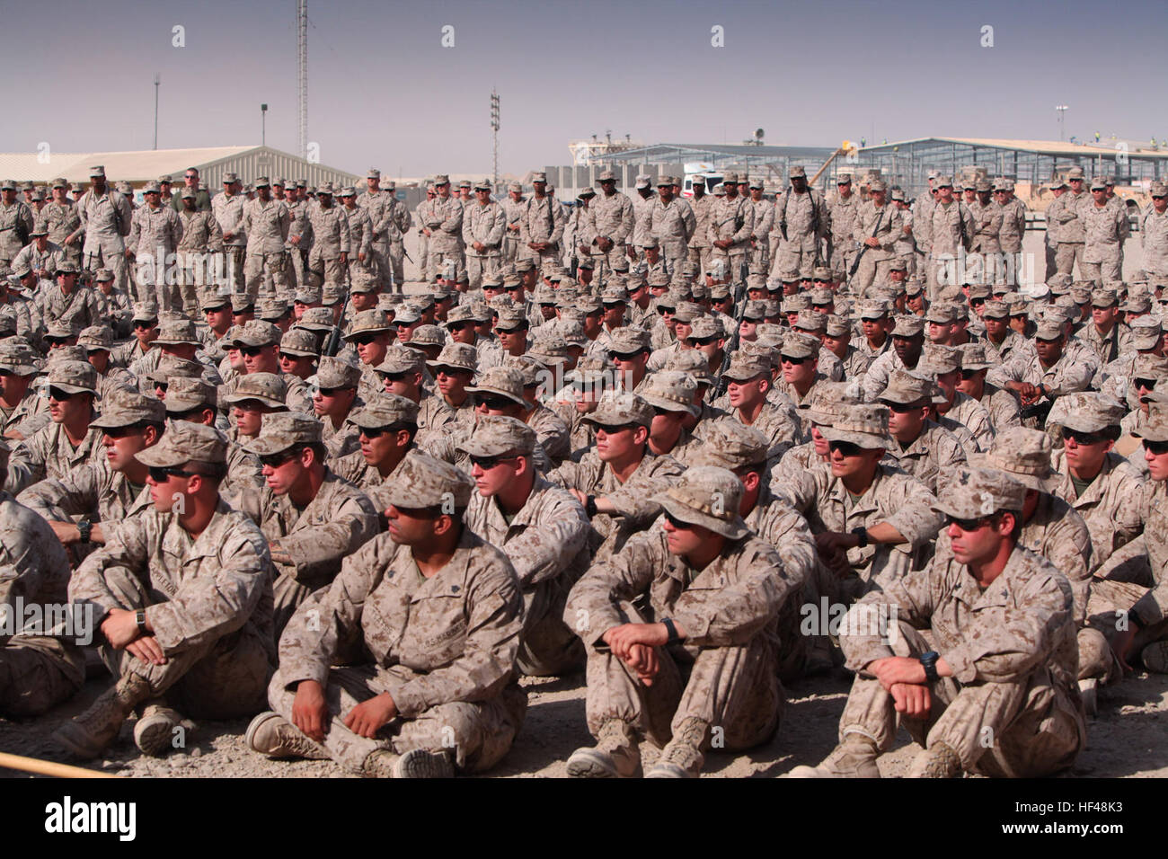 Marines and sailors at Camp Leatherneck listen to comments made by ...