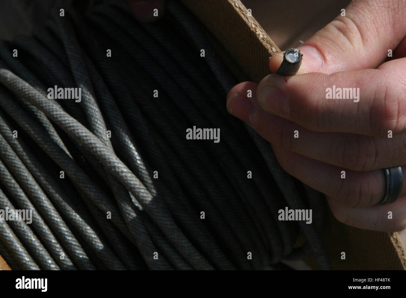 Reinforced detonation cord filled with PETN is prepared for a simulated ...