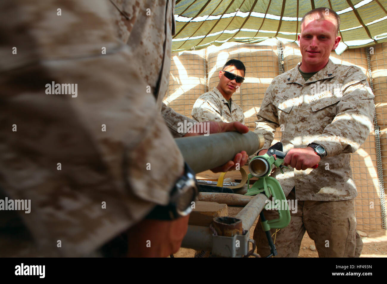 Aviation ordnance technicians at Camp Dwyer assemble a 2.75‑inch ...