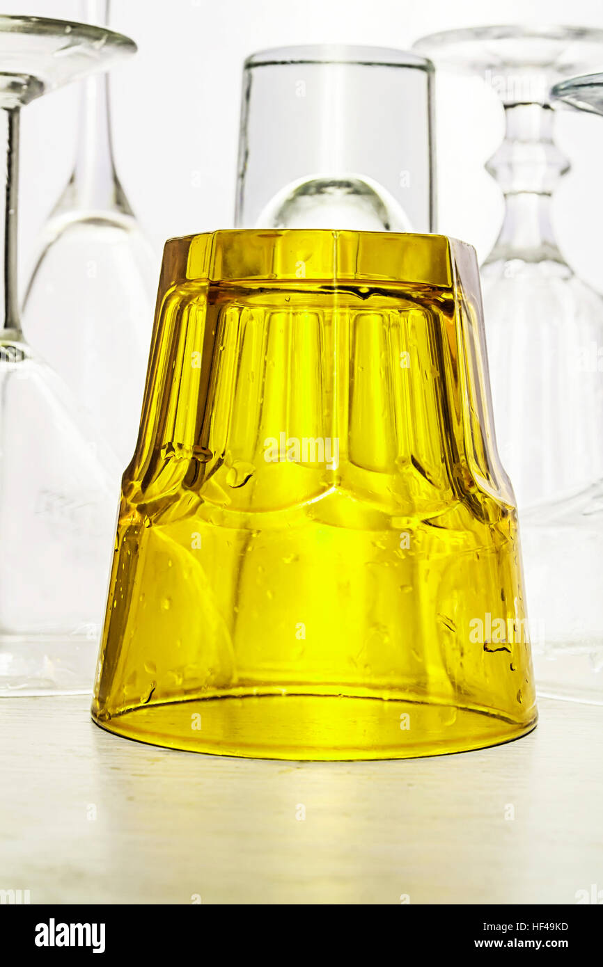 Glass goblets of different shapes and a multi-colored on a white ...