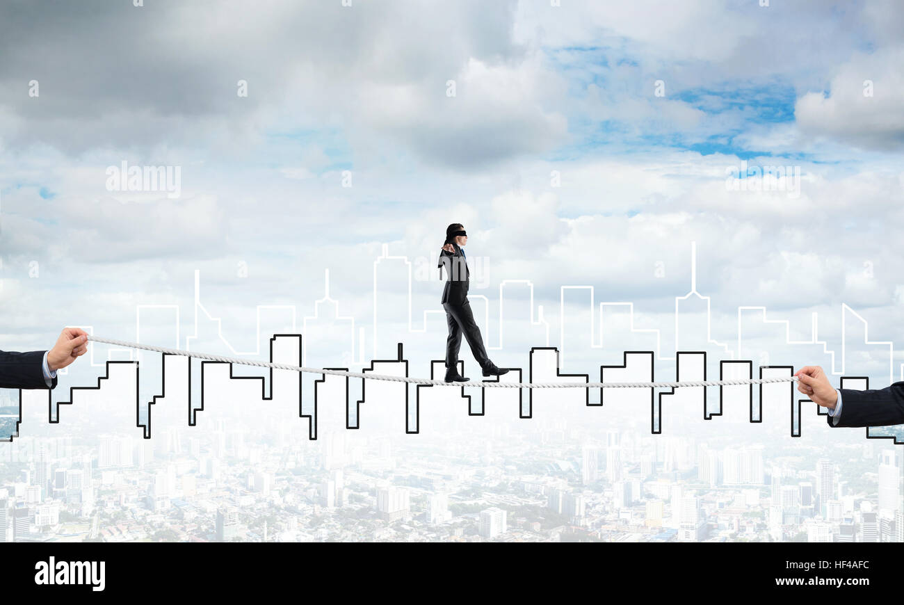 Business concept of risk support and assistance with man balancing on ...