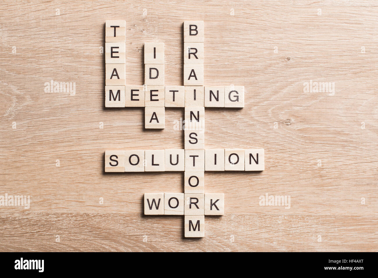 Conceptual business keywords on table with elements of game making ...