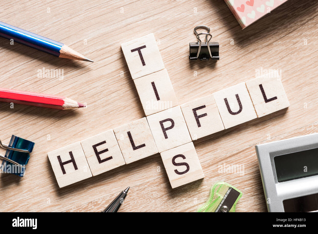 Helpful tips concept on business workplace collected of woodens cubes ...