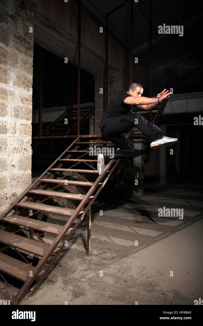 man jumping from stairs very high Stock Photo - Alamy