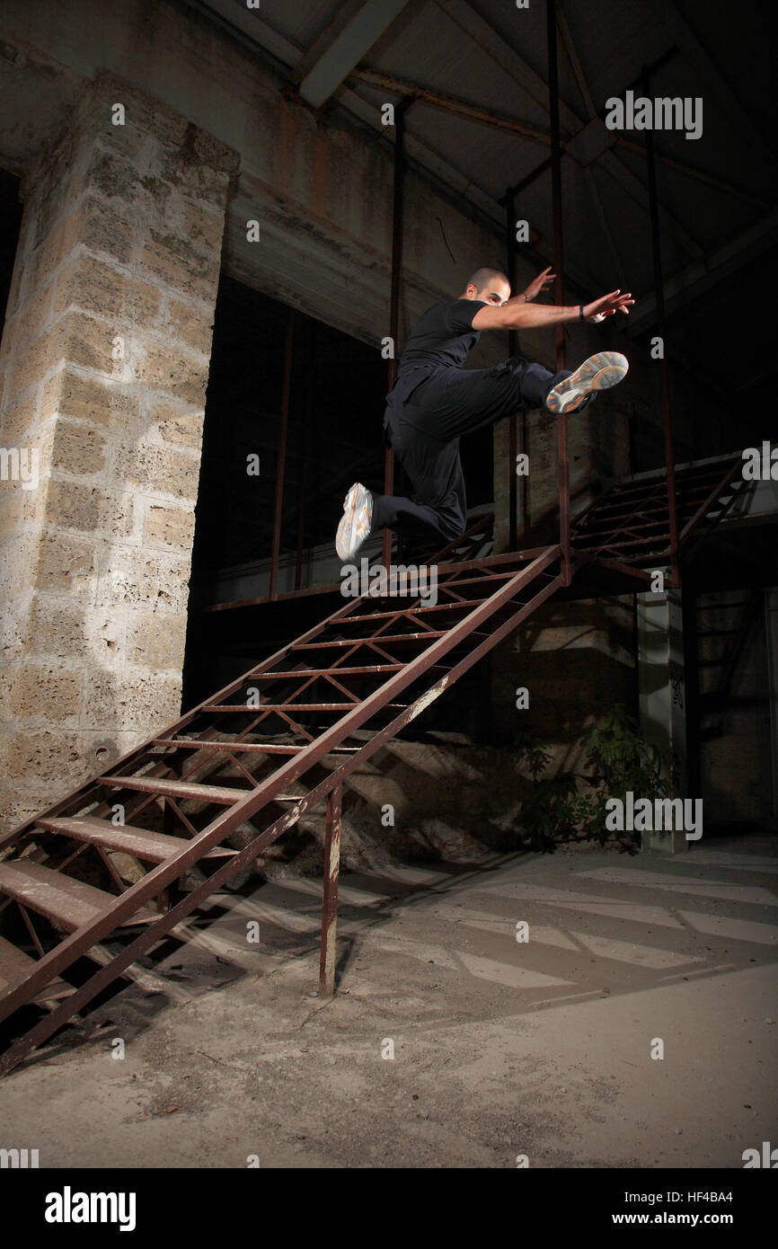 man jumping from stairs very high Stock Photo - Alamy