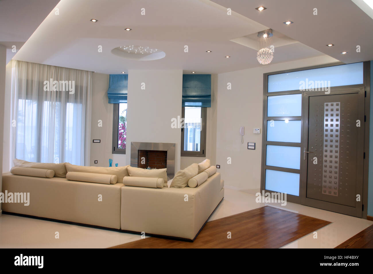 living room with fire place of luxury apartment Stock Photo - Alamy