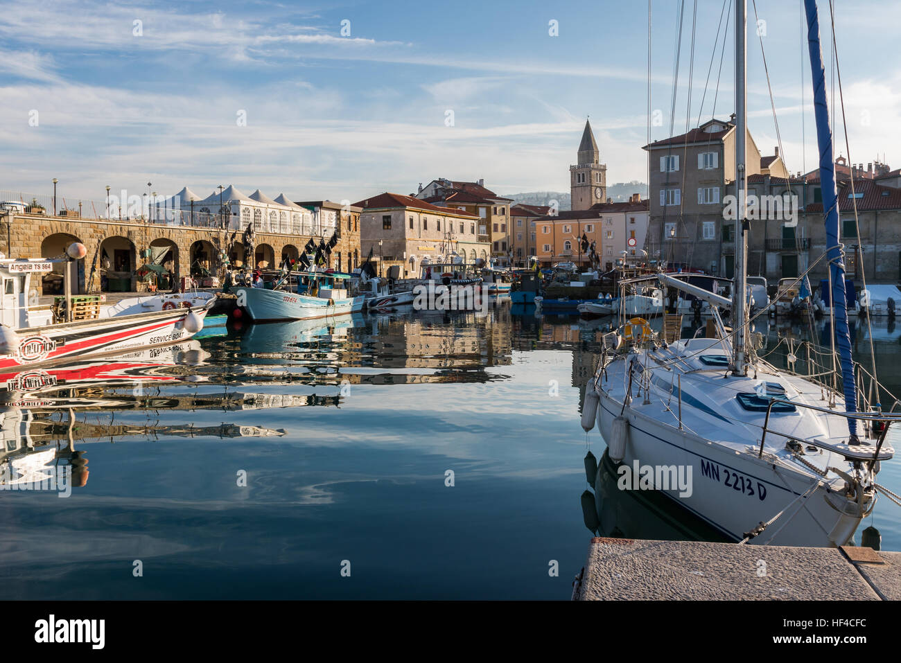 Boats moored in old port of Muggia, Italy Stock Photo - Alamy