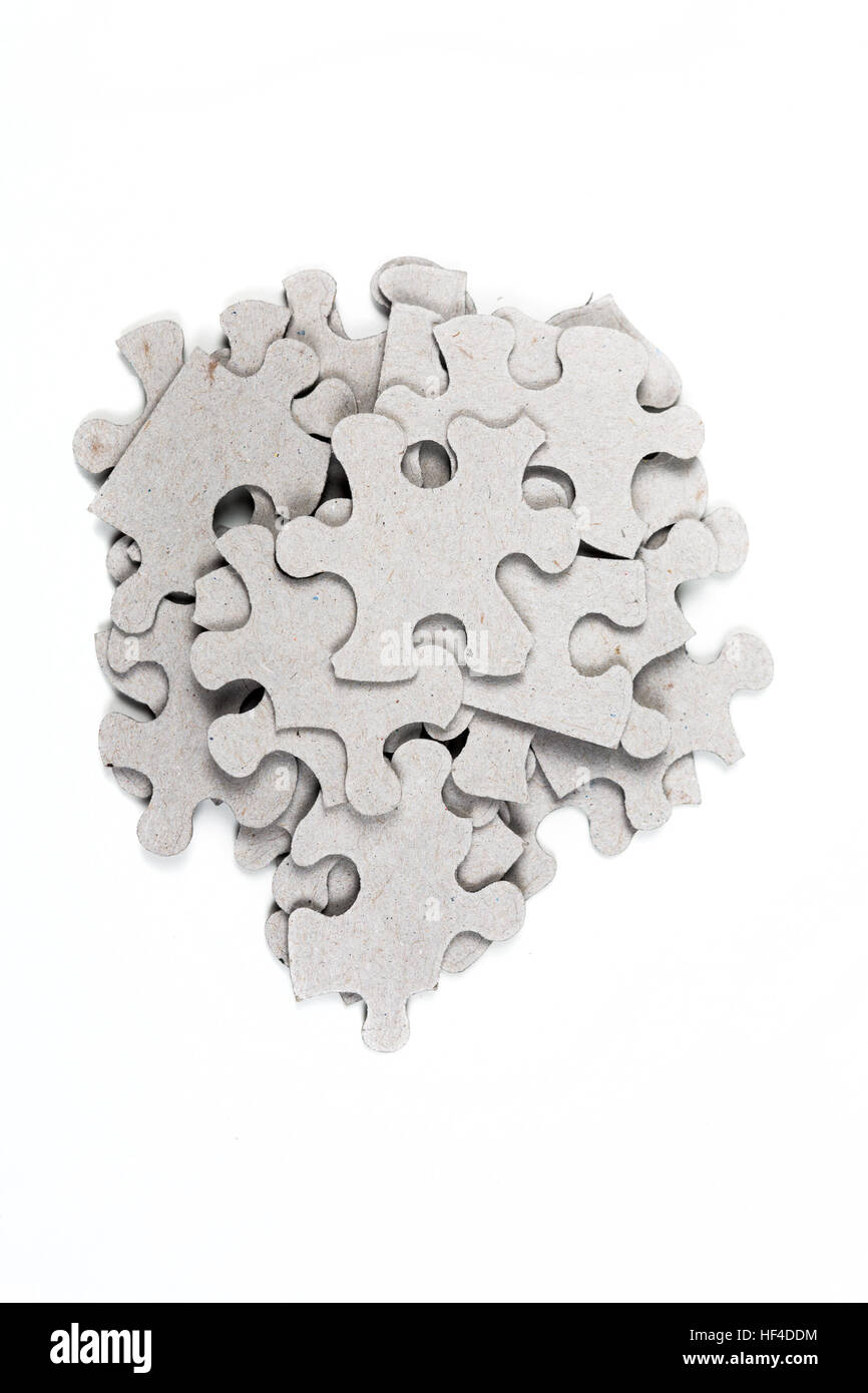 Pile of puzzle pieces isolated on white background Stock Photo - Alamy