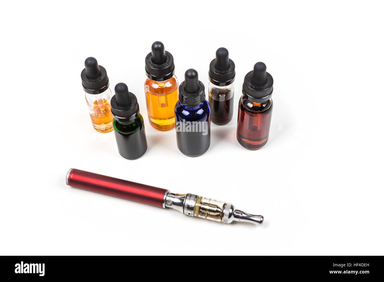 Assorted flavors of vape juice and an ecigarette isolated on white ...
