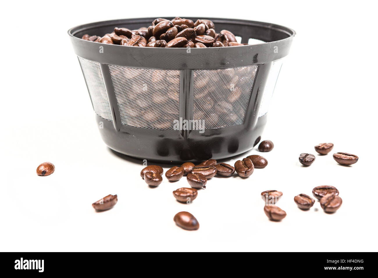 Reusable coffee filter filled with beans isolated on white background ...