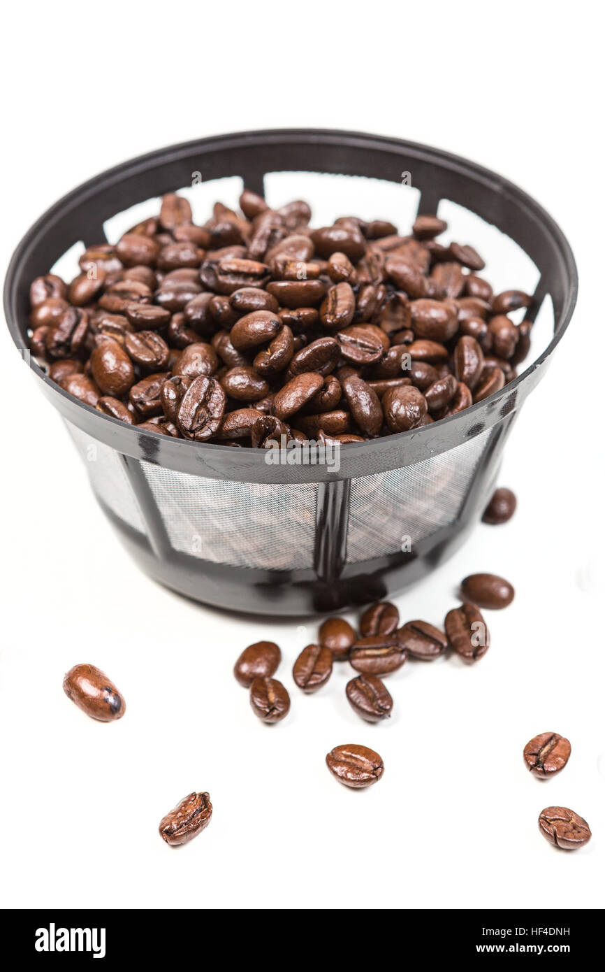 Reusable coffee filter filled with beans isolated on white background ...