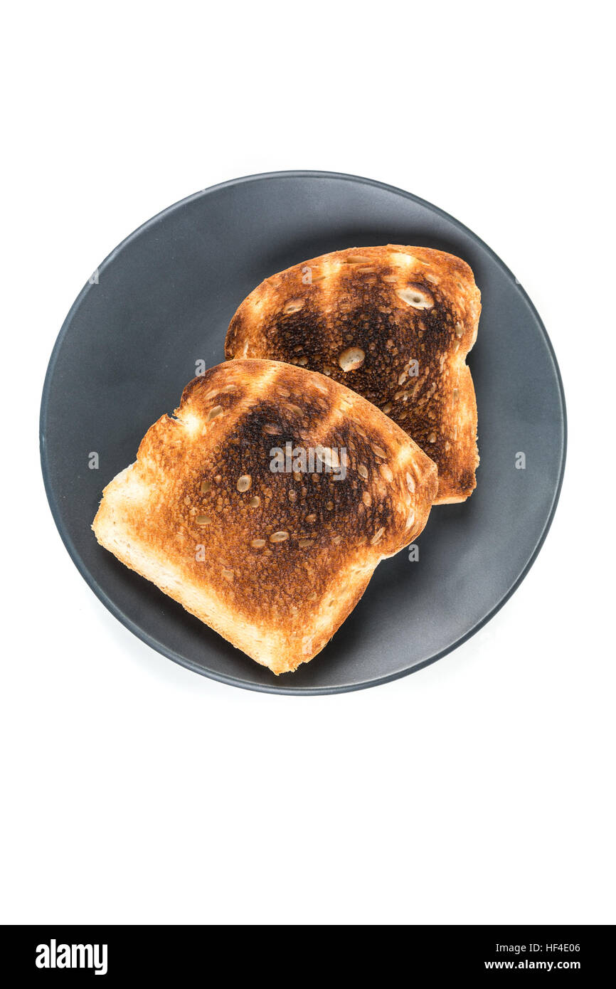 Burned whole grain toast isolated on white background Stock Photo - Alamy