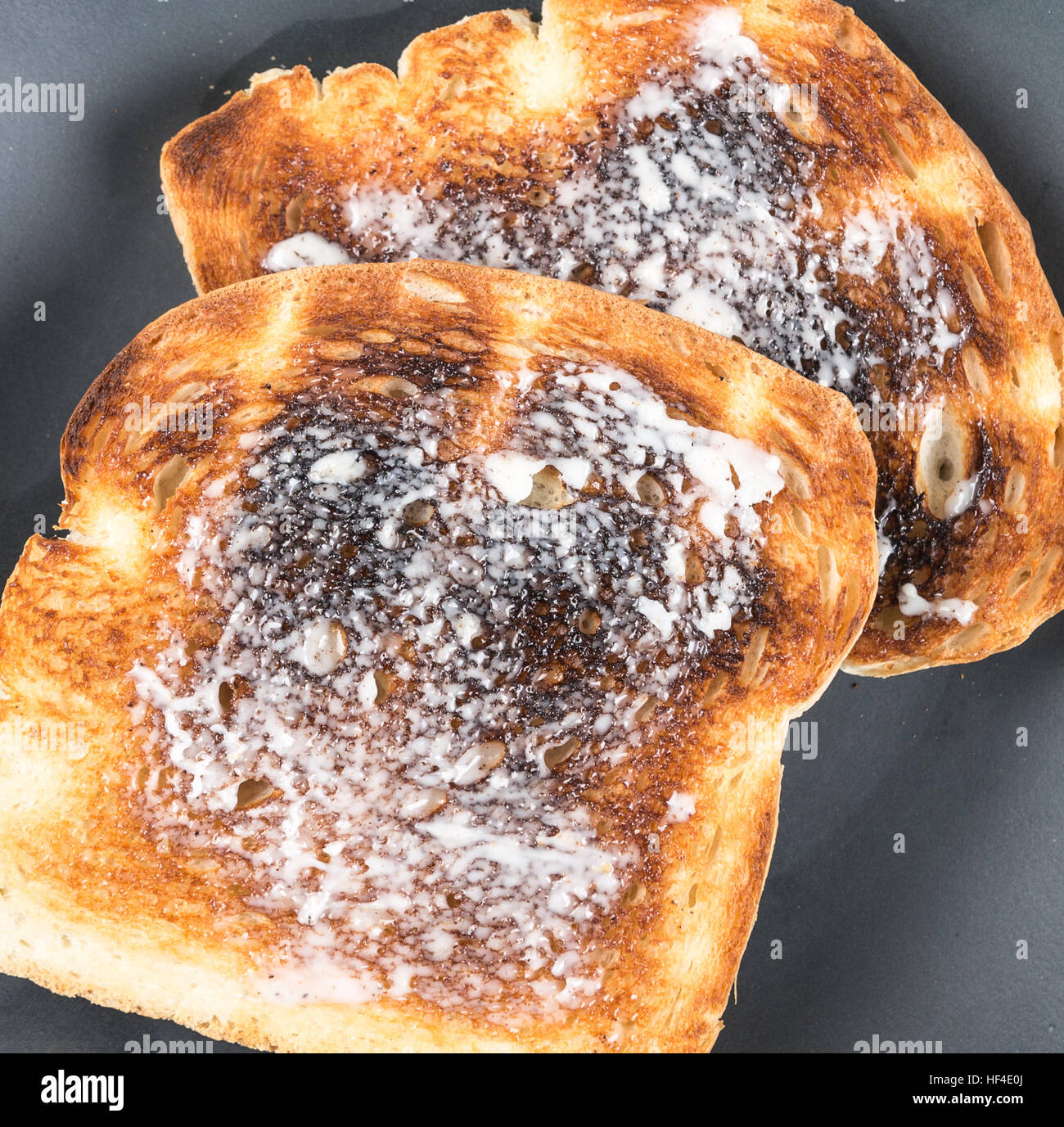 Burned whole grain toast Stock Photo - Alamy