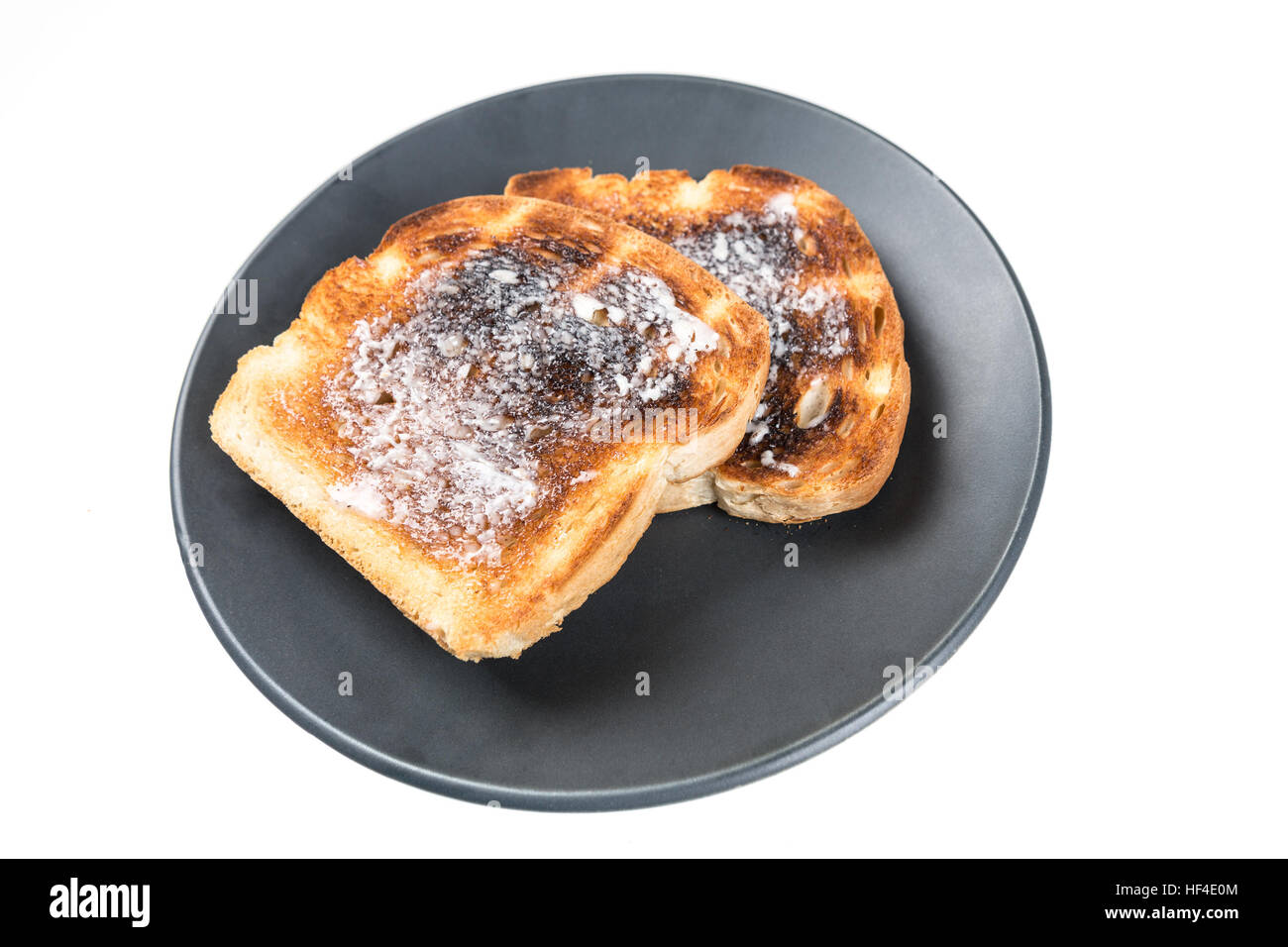 Burned whole grain toast isolated on white background Stock Photo - Alamy
