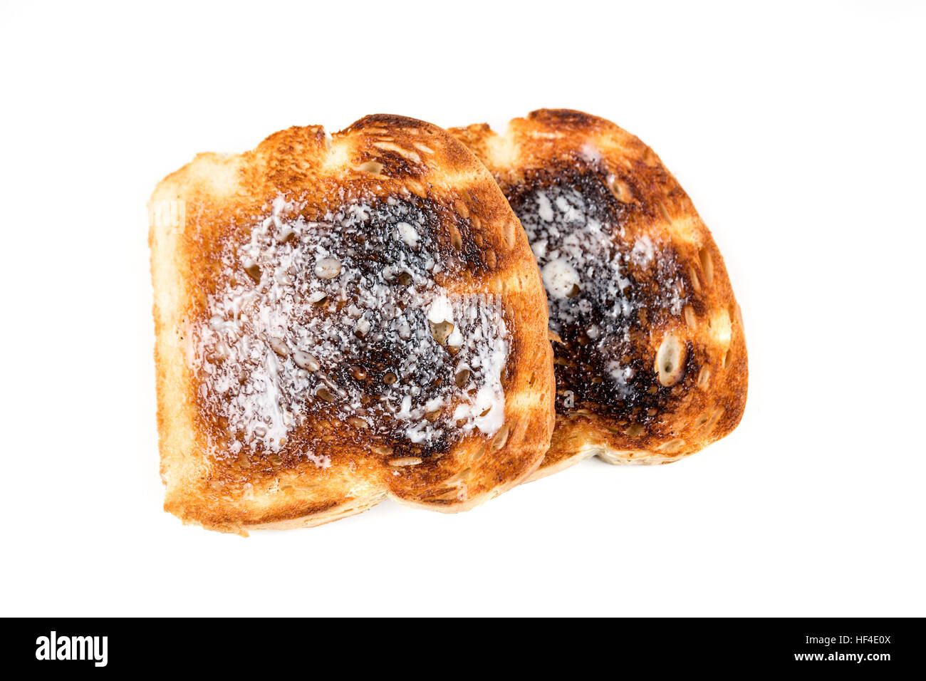 Burned whole grain toast isolated on white background Stock Photo - Alamy