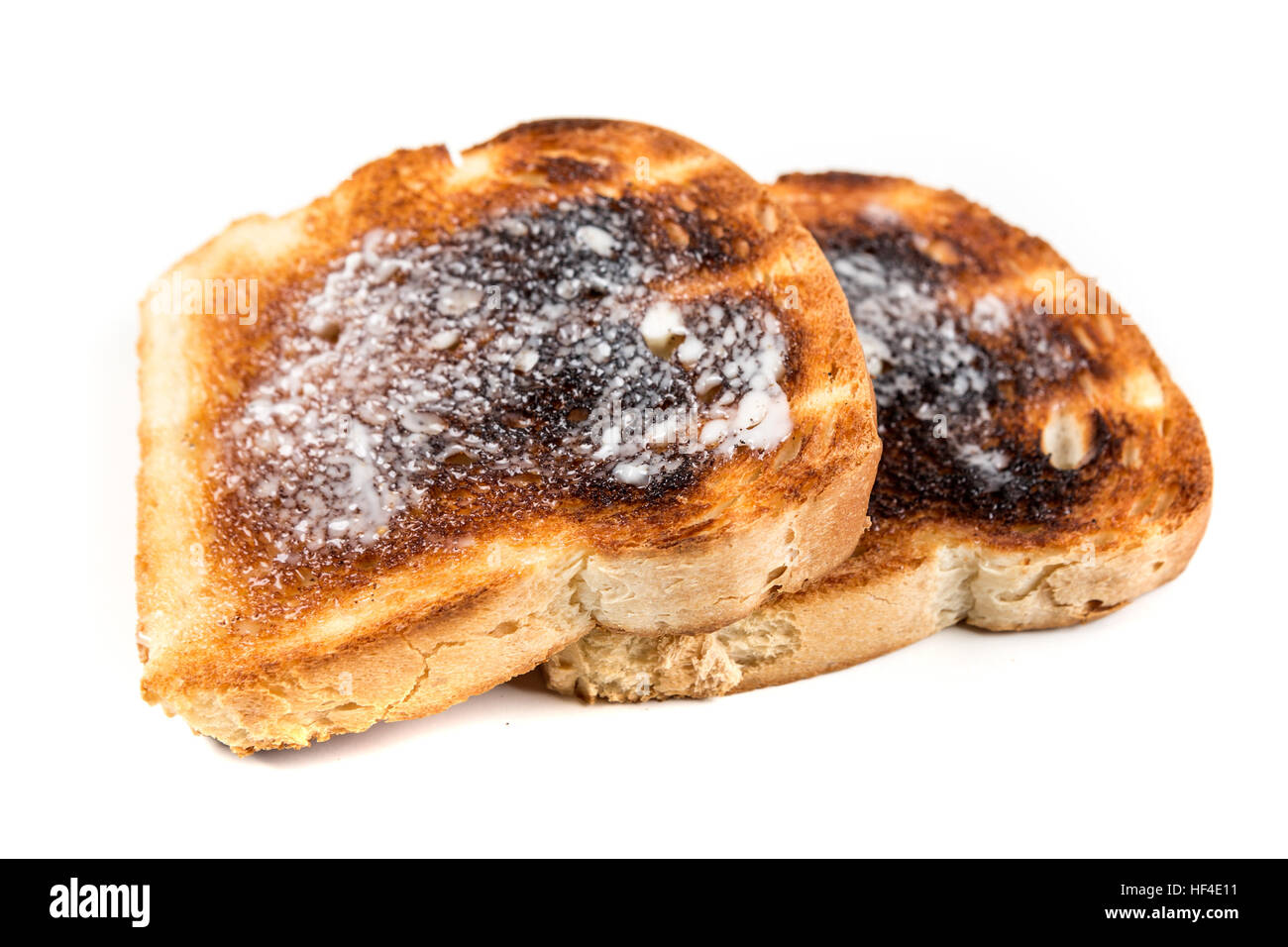 Burned whole grain toast isolated on white background Stock Photo - Alamy