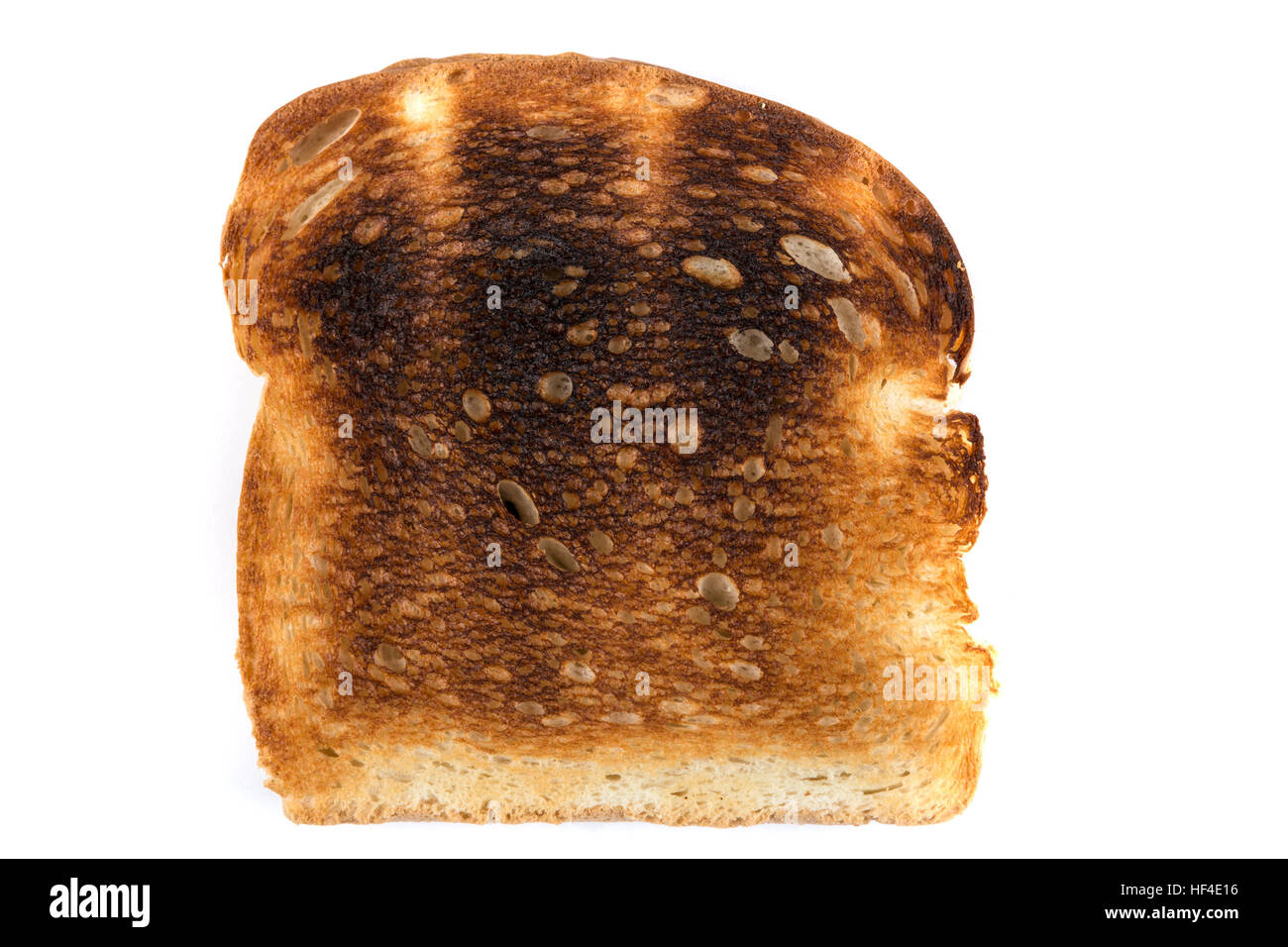 Burned whole grain toast isolated on white background Stock Photo - Alamy