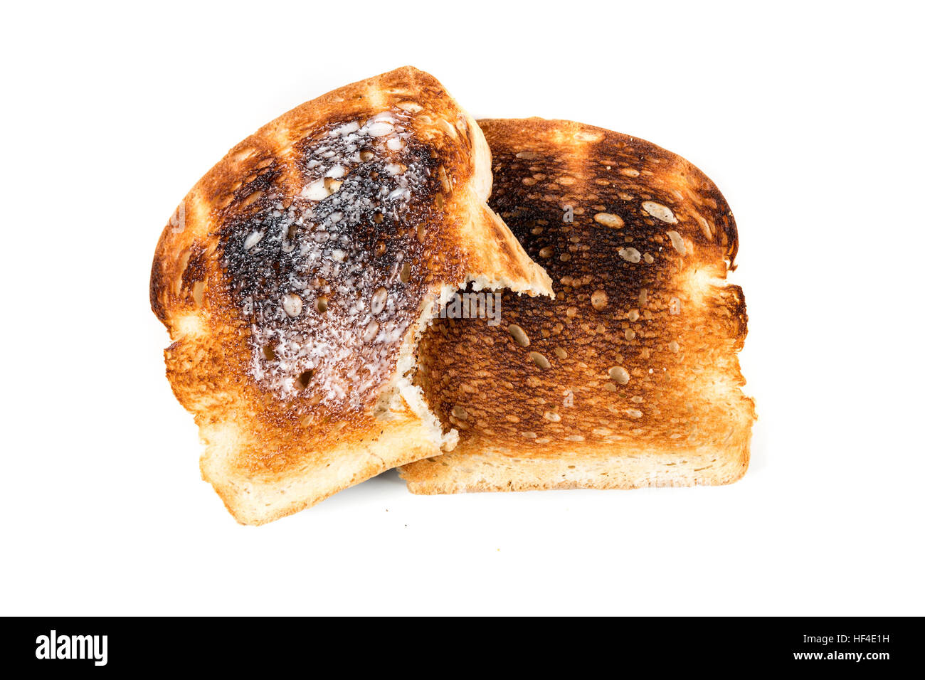 Burned whole grain toast isolated on white background Stock Photo - Alamy