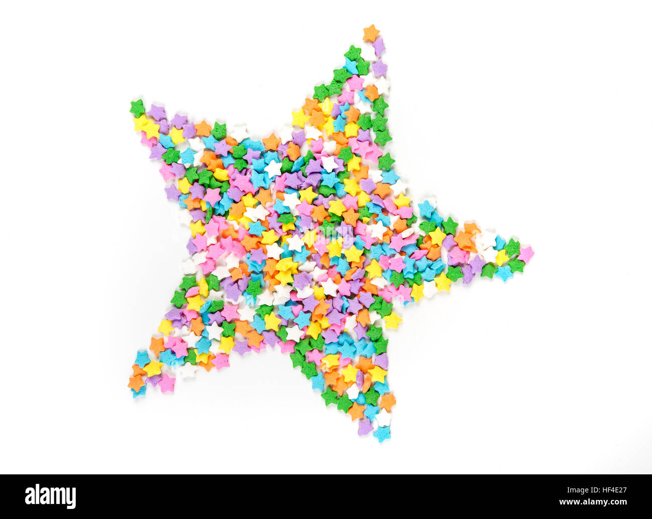 Star shaped assorted rainbow colored sprinkles isolated on white ...