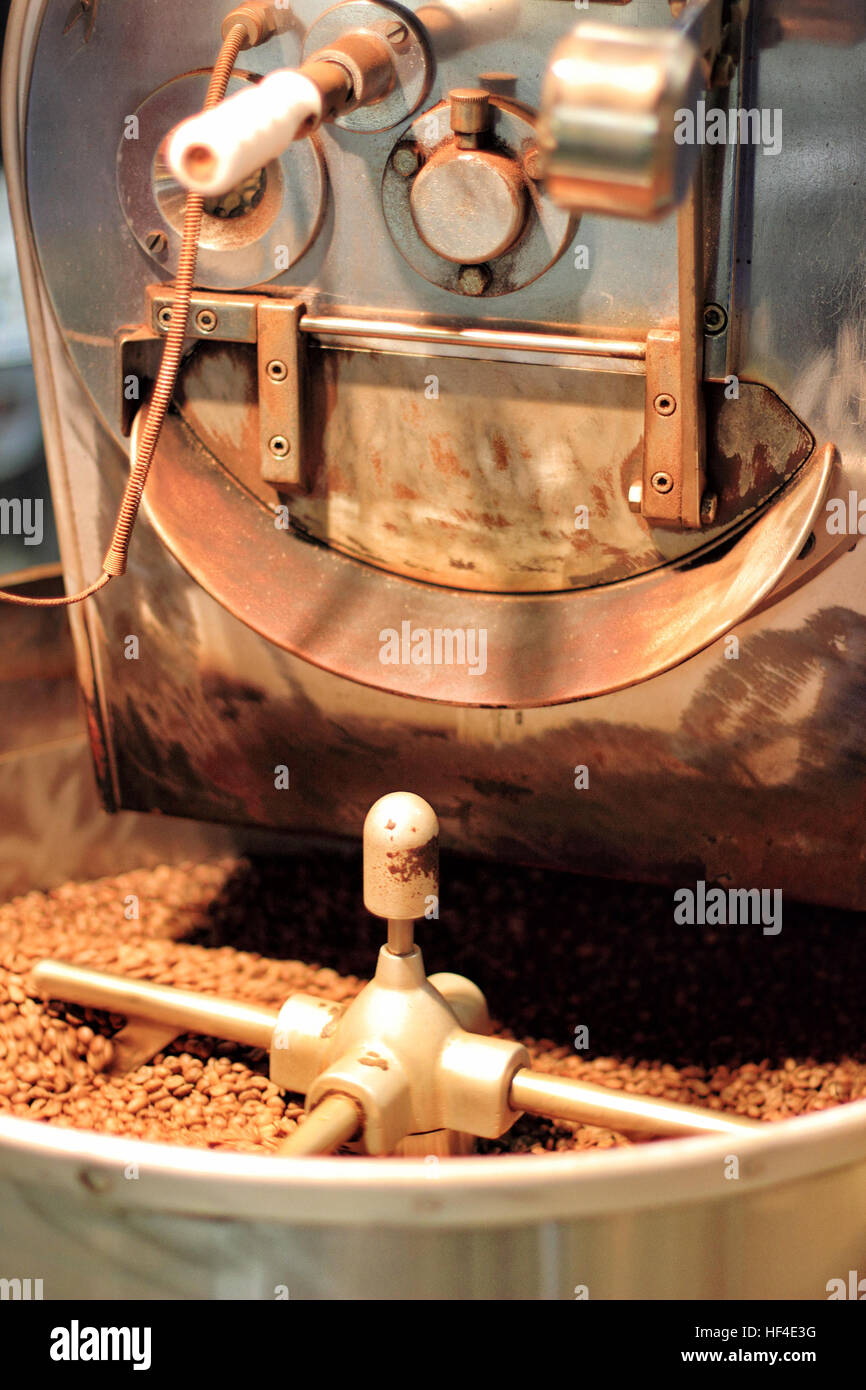 fresh coffe beans mix on a roast machine in a coffee shop Stock Photo ...