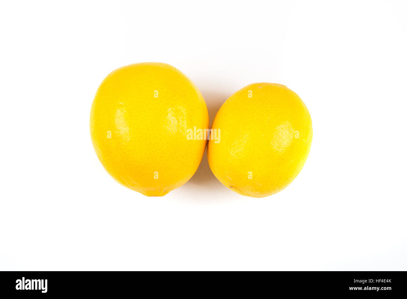 Two meyer lemons isolated on white background Stock Photo - Alamy