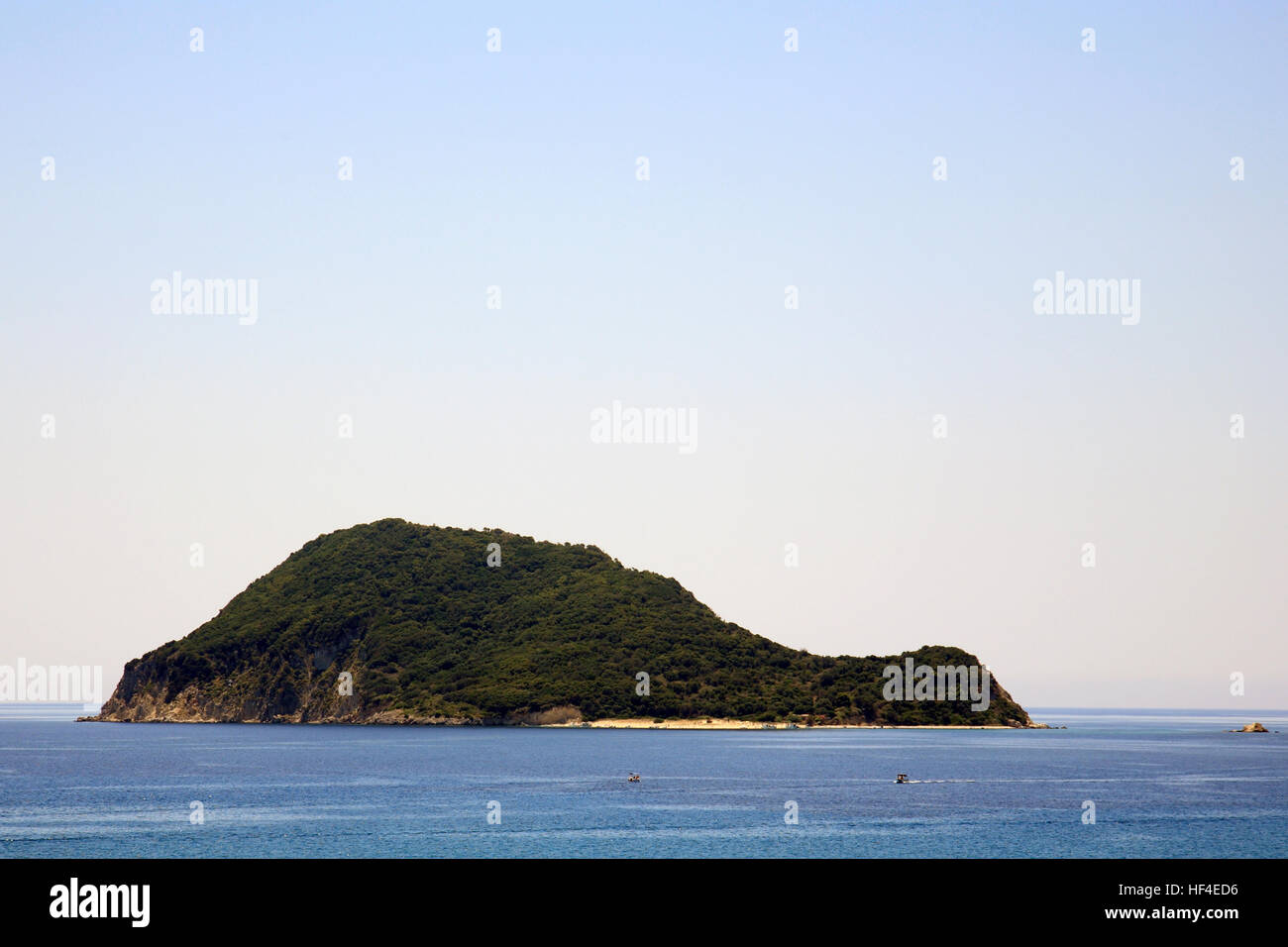 beautiful small island with blue water in greece Stock Photo - Alamy