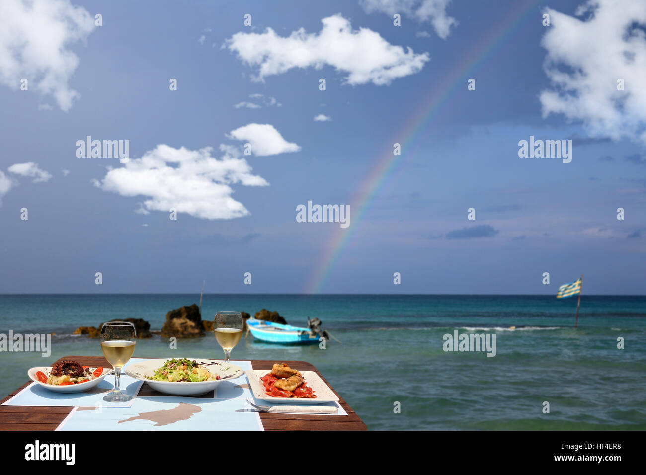 lunch table for two by the sea with nice rainbow Stock Photo - Alamy
