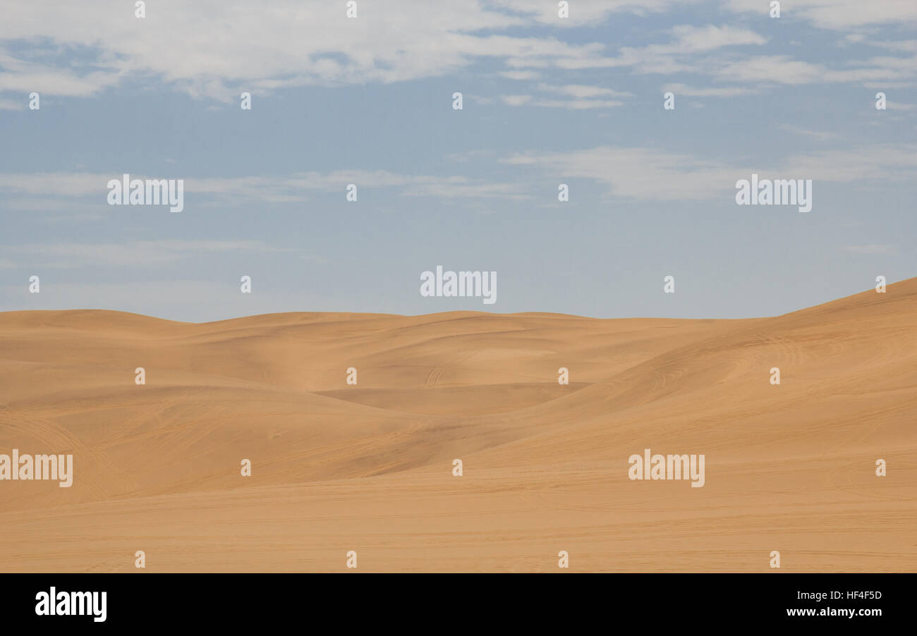 view from the road to the African dunes in the desert near the ocean ...