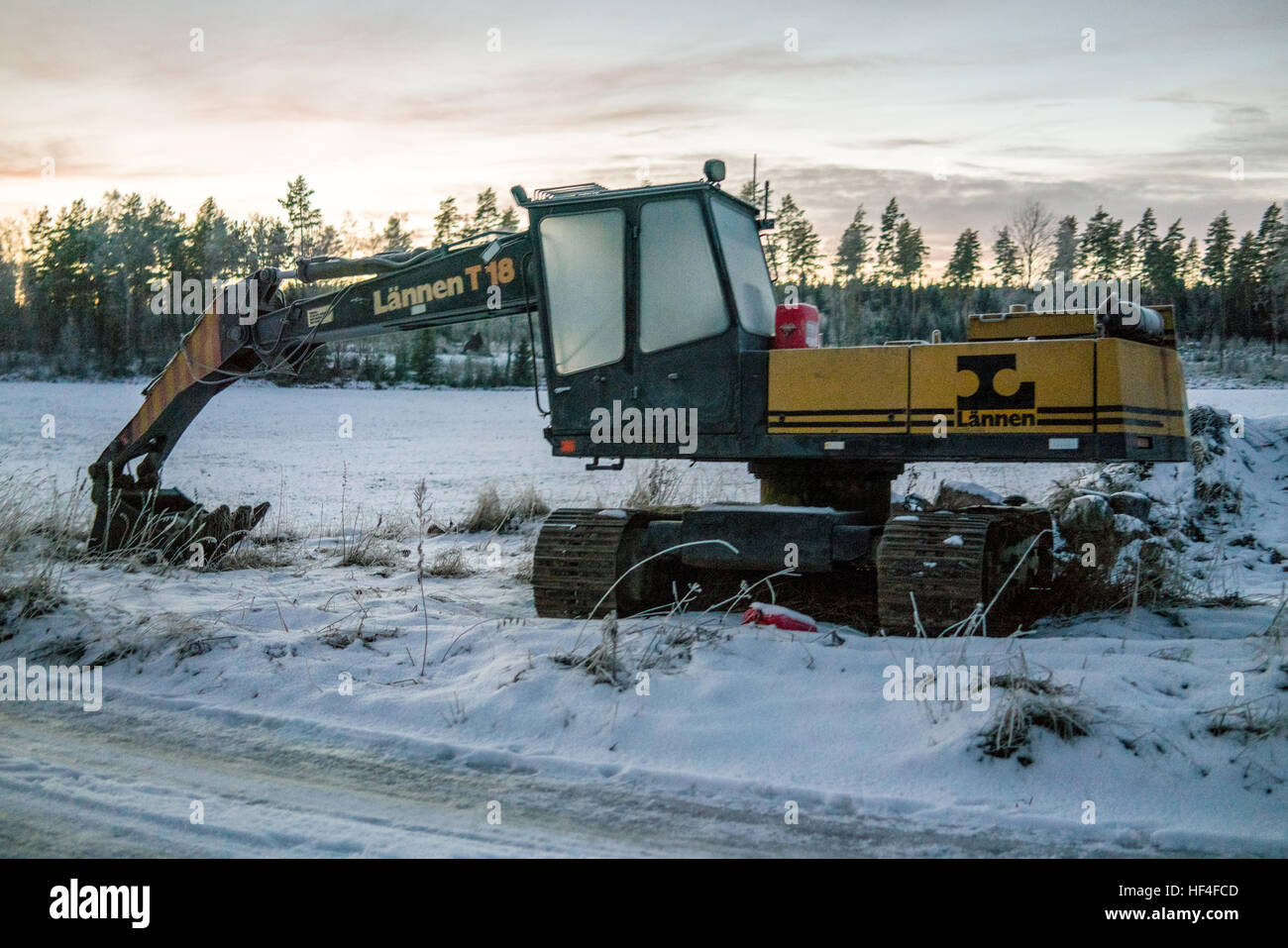 Winter and snow and a parked excavator Stock Photo - Alamy