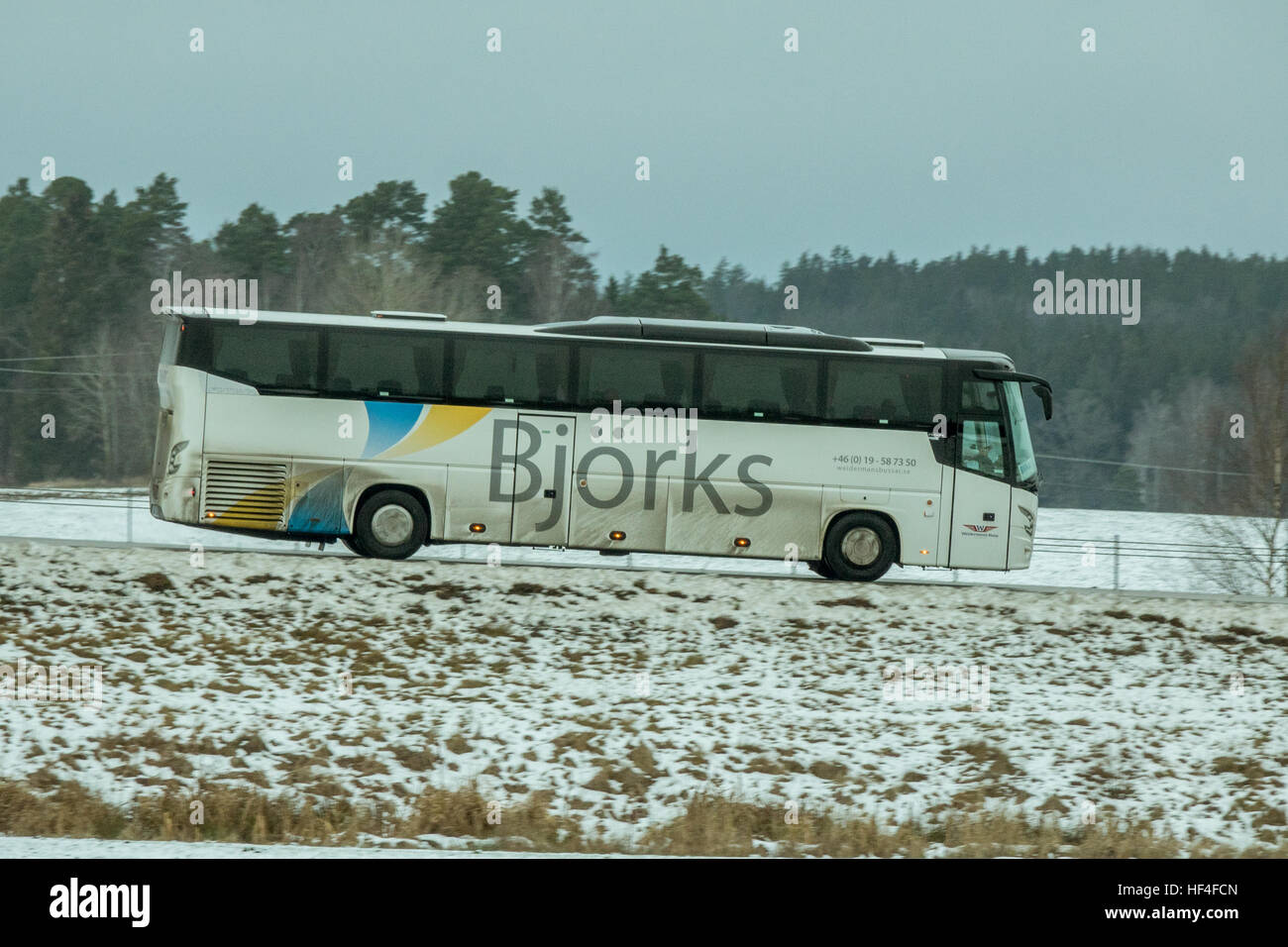 Buss coach on the open road Stock Photo - Alamy