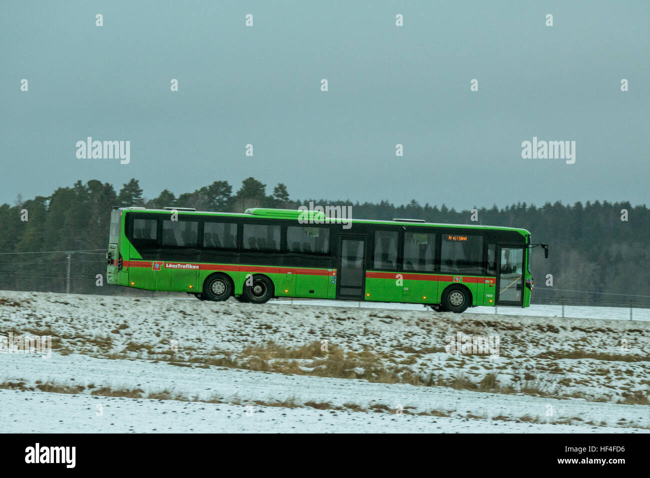 Green bus on a upcountry road Stock Photo - Alamy