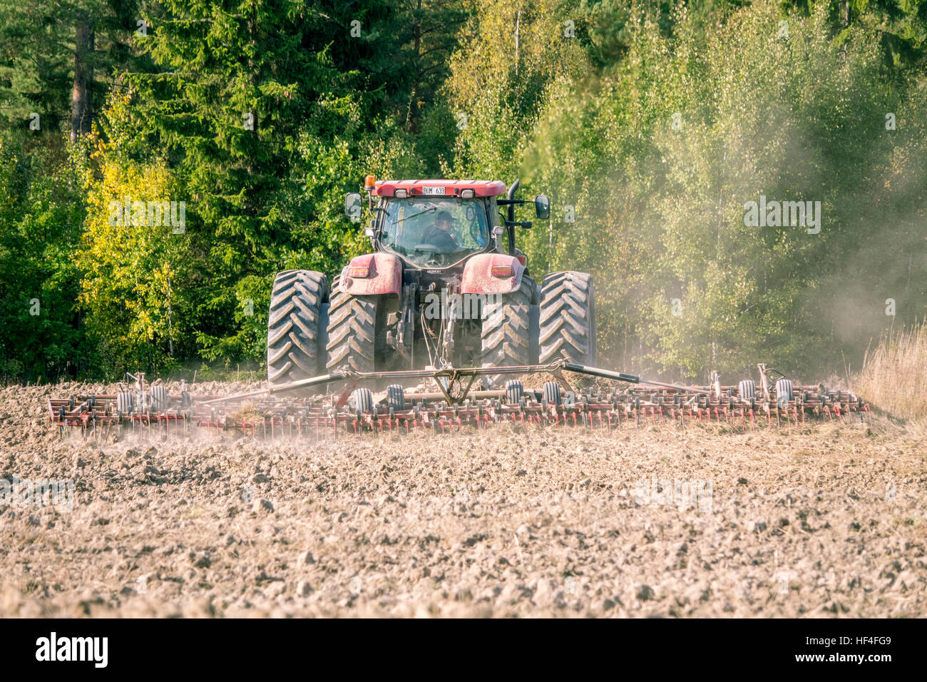 Tractor plowing using a chisel plow Stock Photo - Alamy