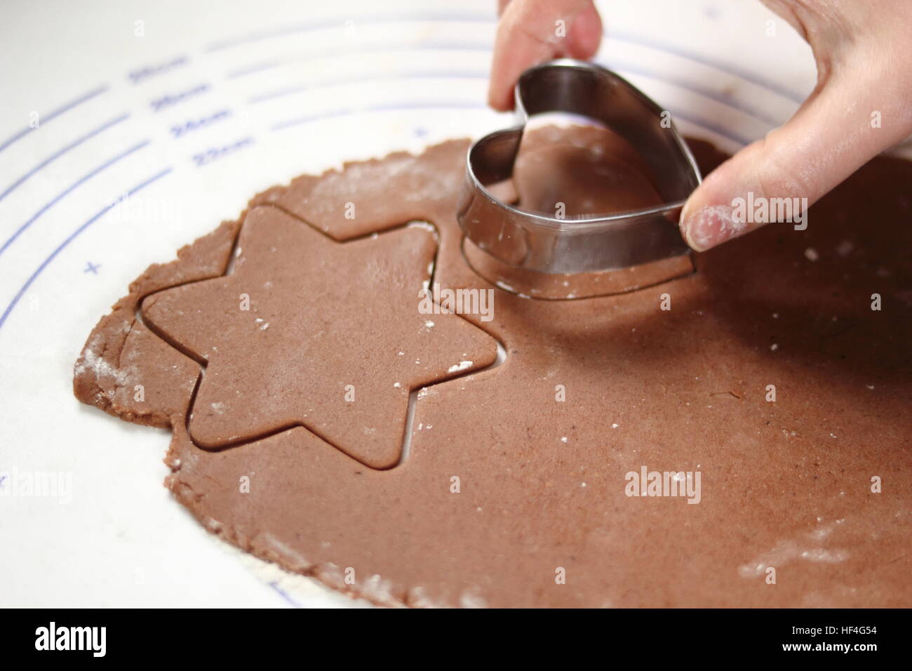 Cutting dough sheet into shapes. Making Gingerbread Cookies Series ...