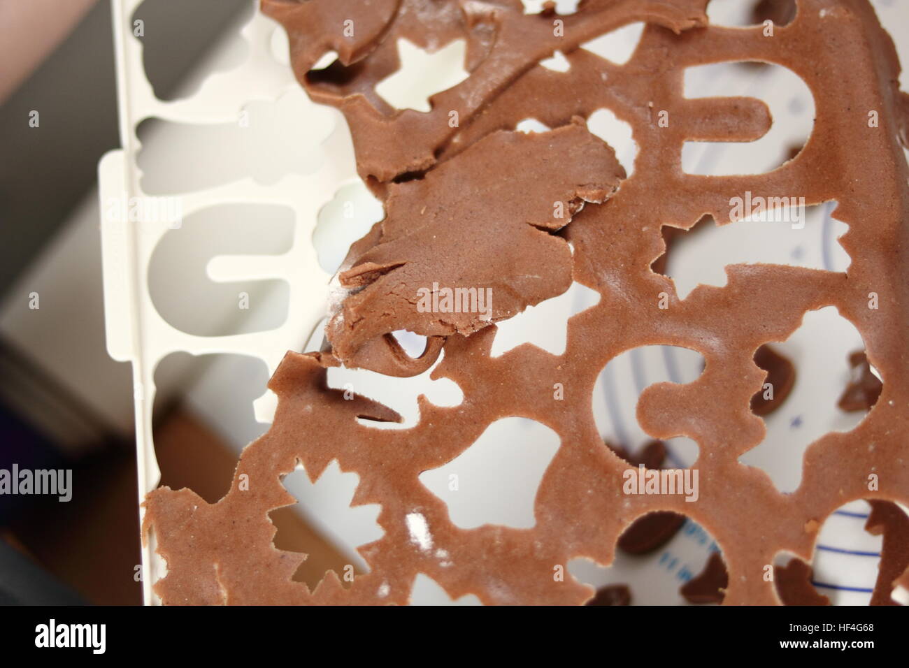 Remove excess of dough from cutting sheet. Making Gingerbread Cookies ...