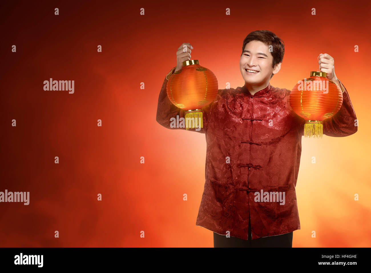 Asian man with cheongsam shirt holding chinese lantern. Happy chinese ...