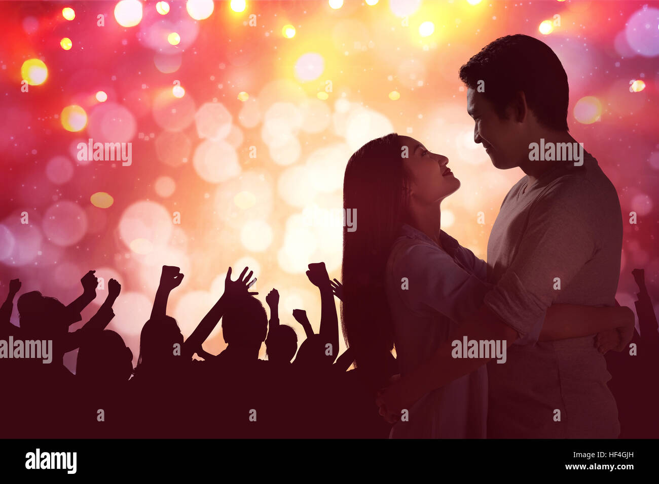 Smiling asian couple in love against blurred light background Stock ...