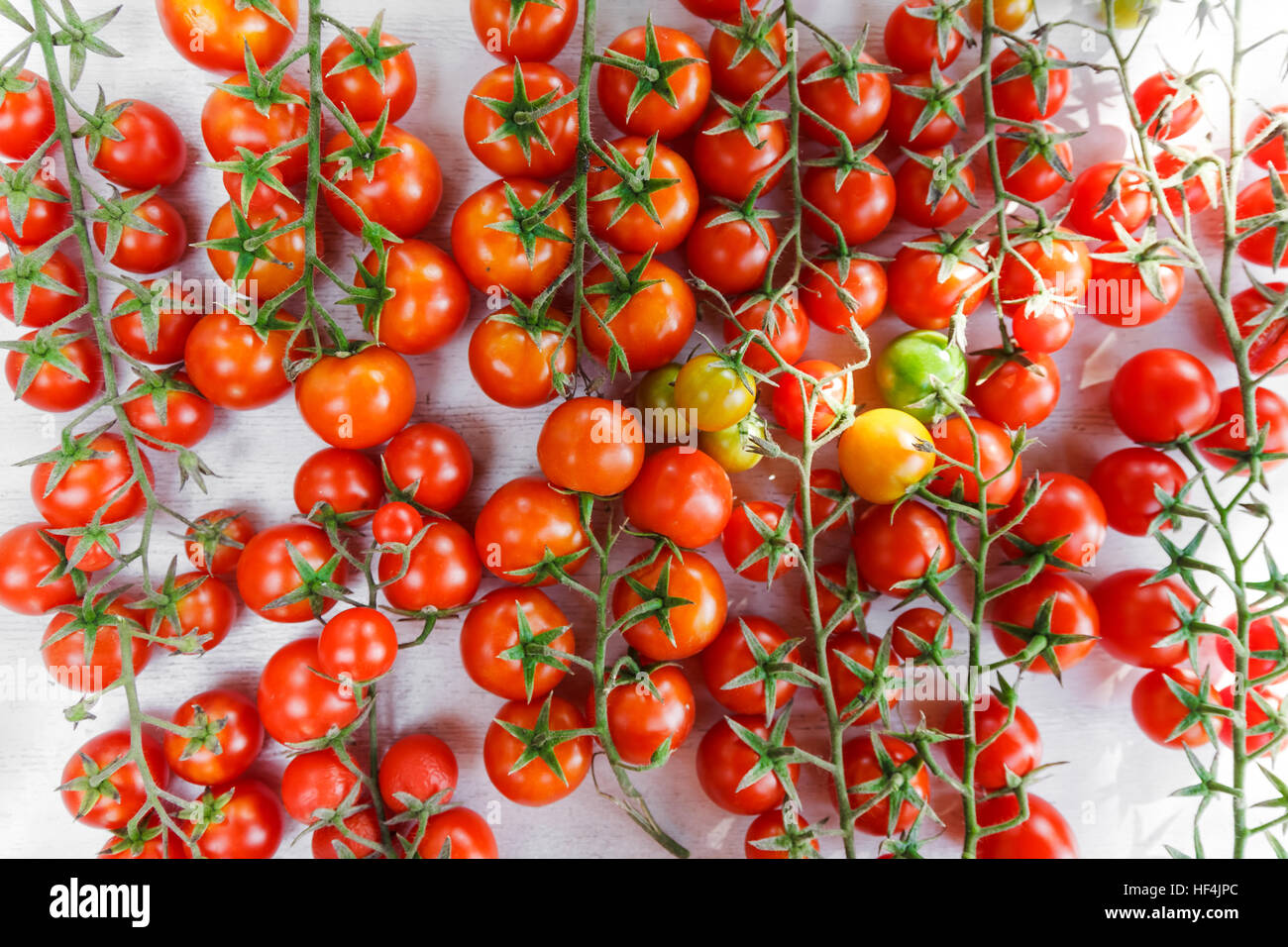 Juicy organic Cherry tomatoes isolated over white background Stock Photo - Alamy