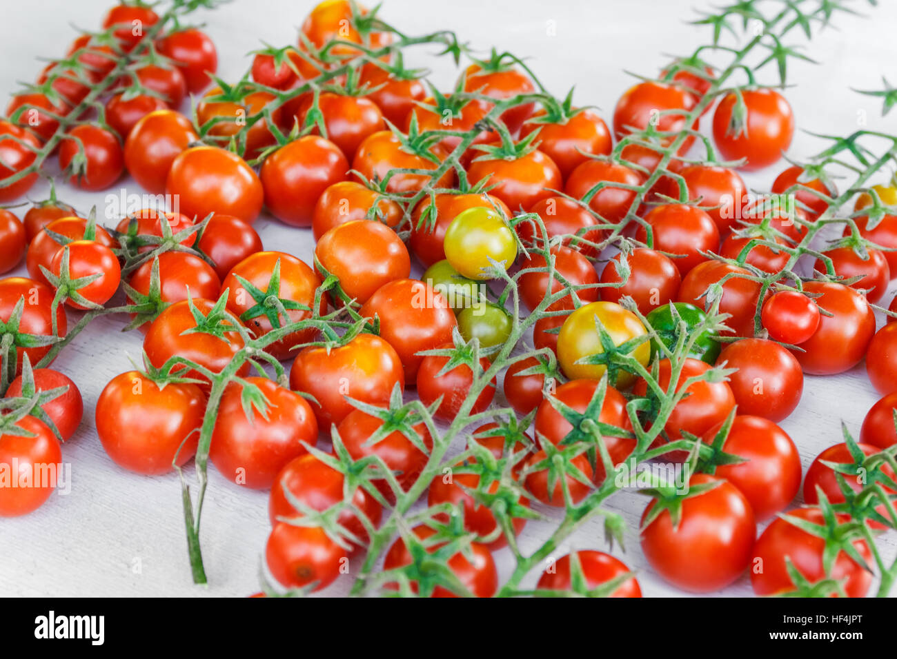 Juicy organic Cherry tomatoes isolated over white background Stock Photo - Alamy