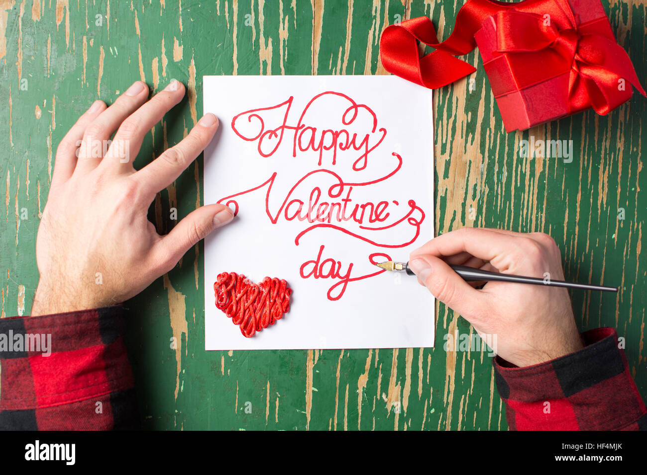 Male hands writing a calligraphy Valentines day card Stock Photo - Alamy