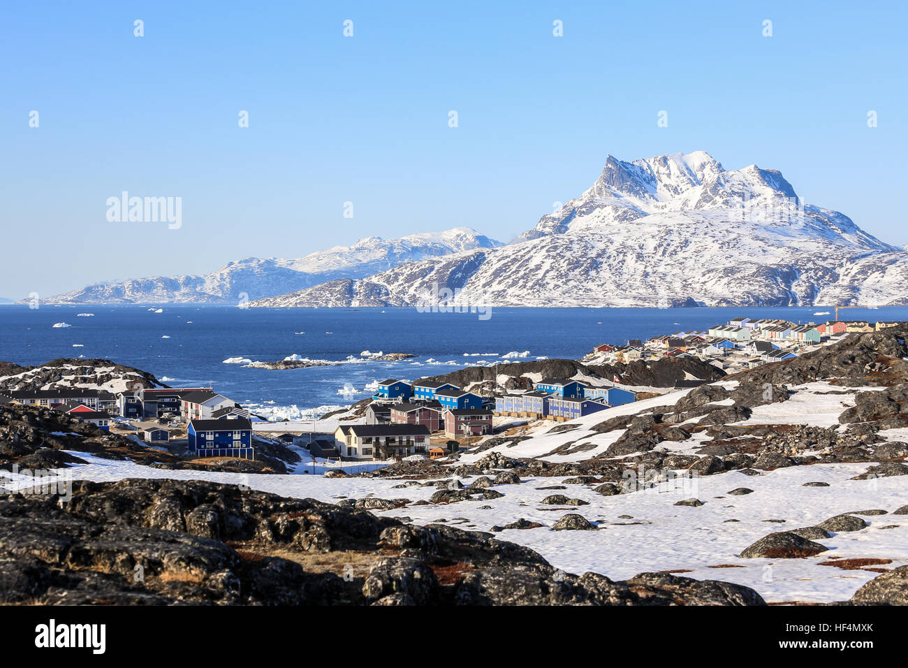 Colorful living blocks of Nuuk city at the fjord, Sermitsiaq mountain in the background ...