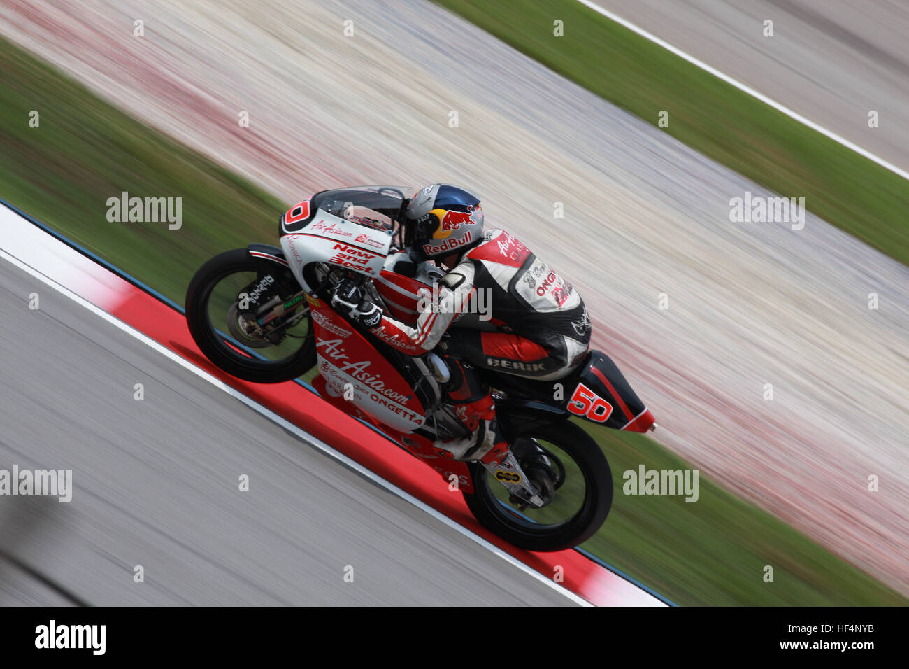 125cc riders in action at the Sepang International Circuits Stock Photo ...