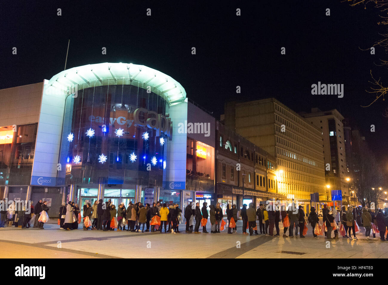 Shoppers queue outside the Next store on Queen Street, Cardiff, from ...