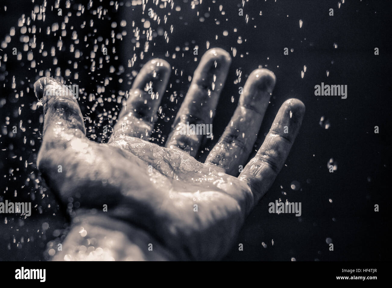 Photograph of an open human hand under water drops Stock Photo - Alamy