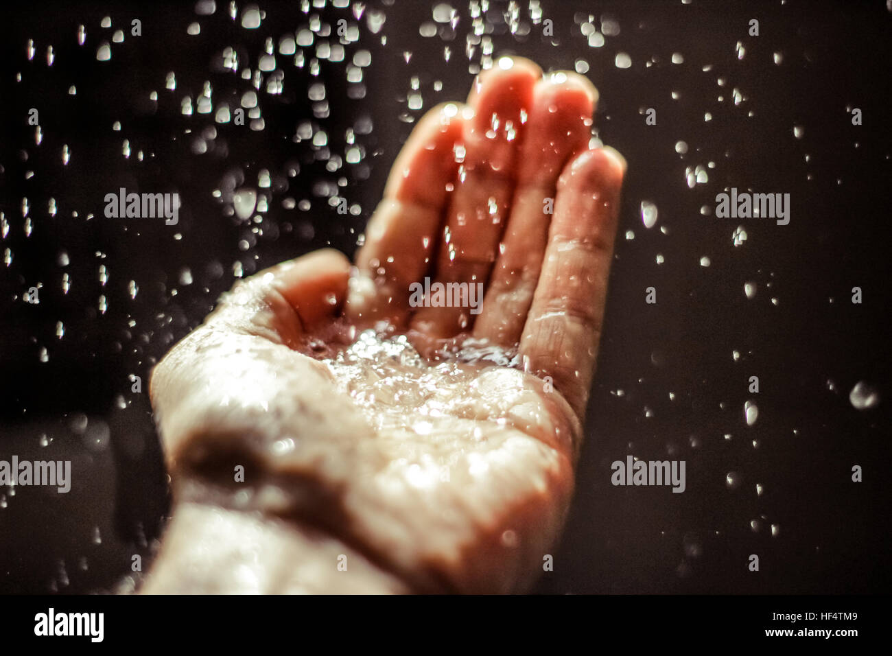 Photograph of an open human hand under water drops Stock Photo - Alamy