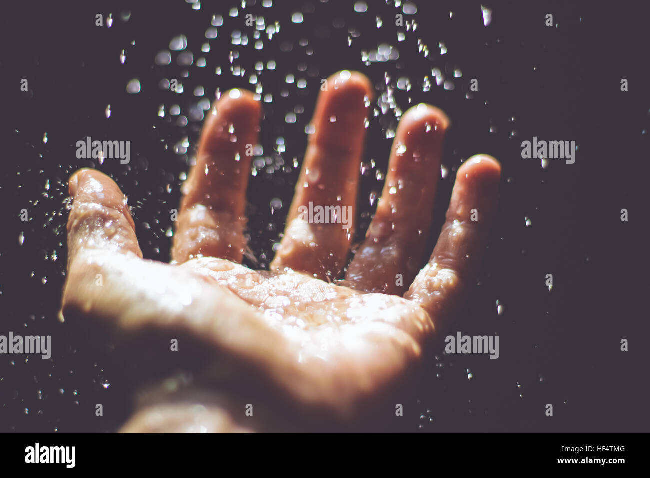 Photograph of an open human hand under water drops Stock Photo - Alamy